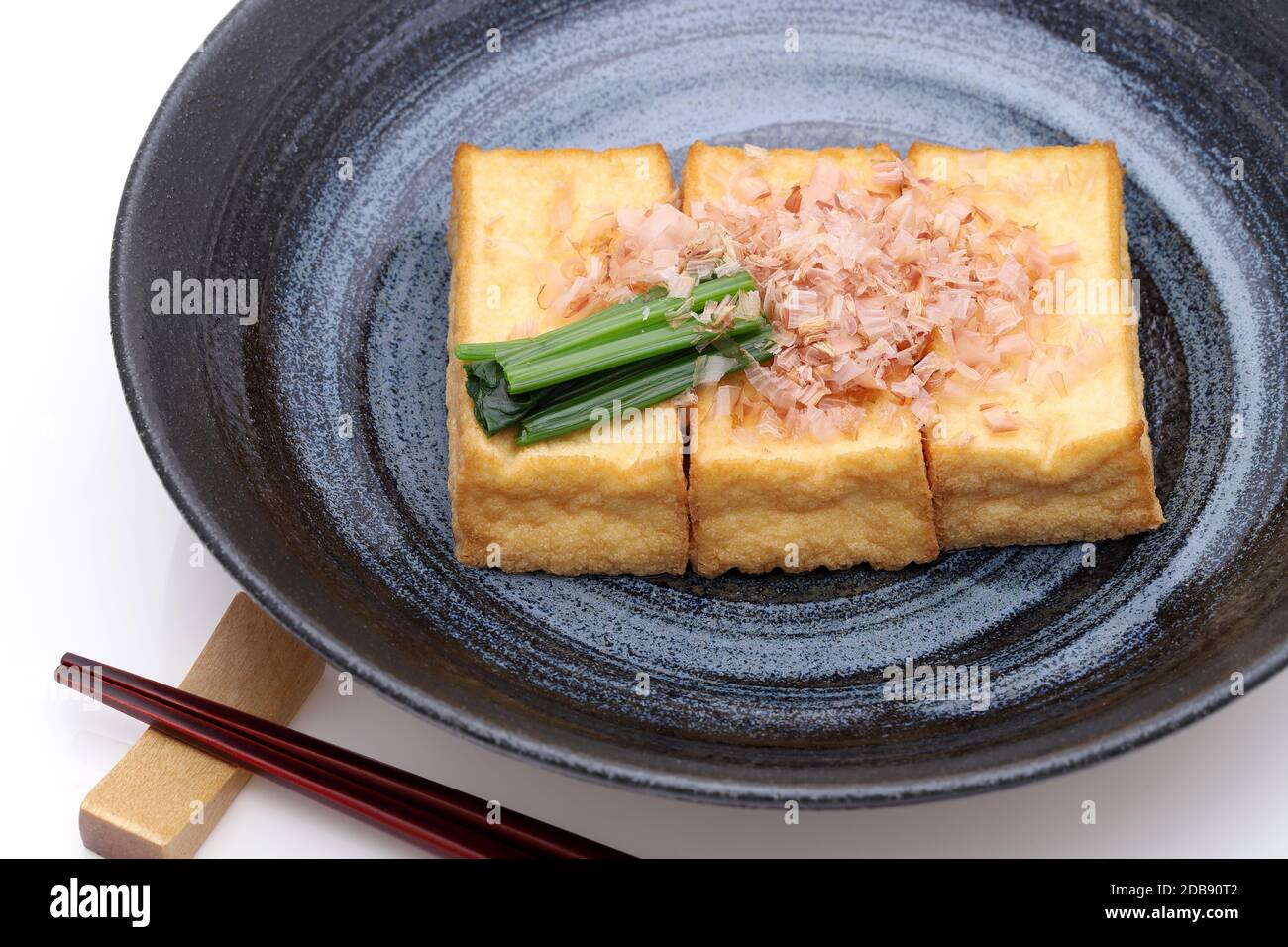 Close up of Japanese food, Age tofu cuisine in a dish on white ...