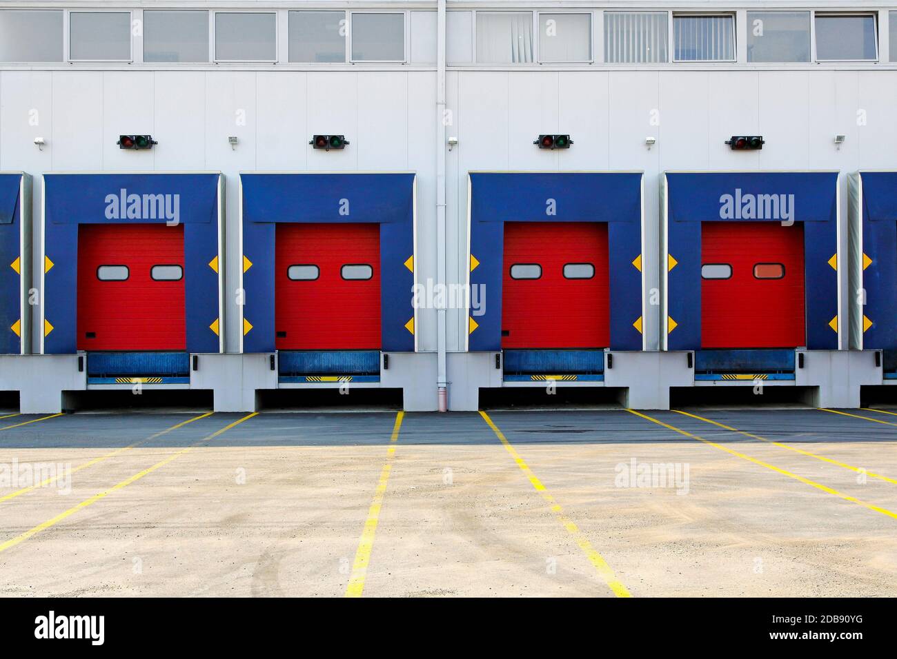 Many loading dock doors at big warehouse Stock Photo - Alamy