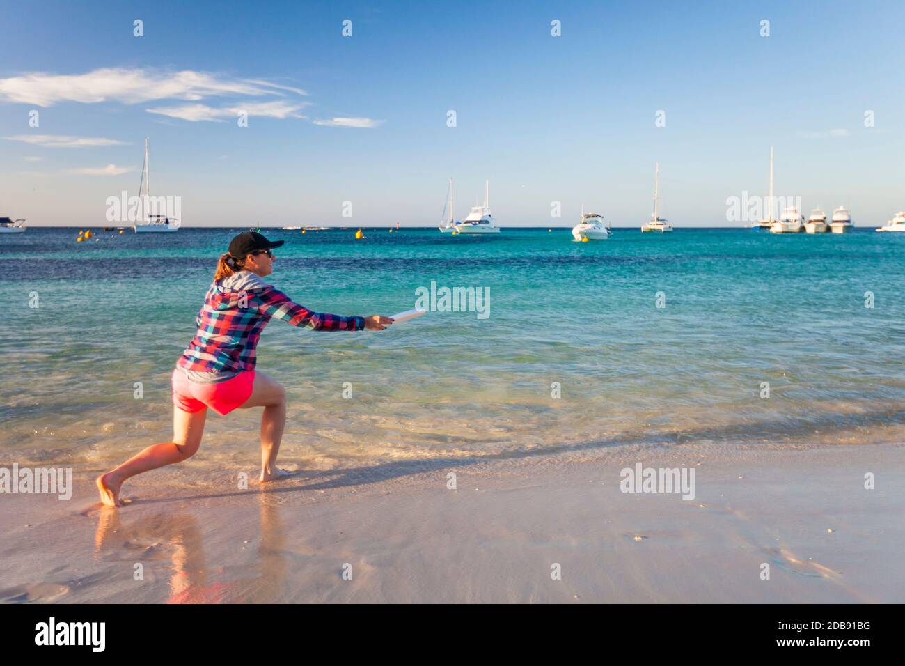 Throwing a frisbee on the beach, Rottnest Island, Australia Stock Photo ...