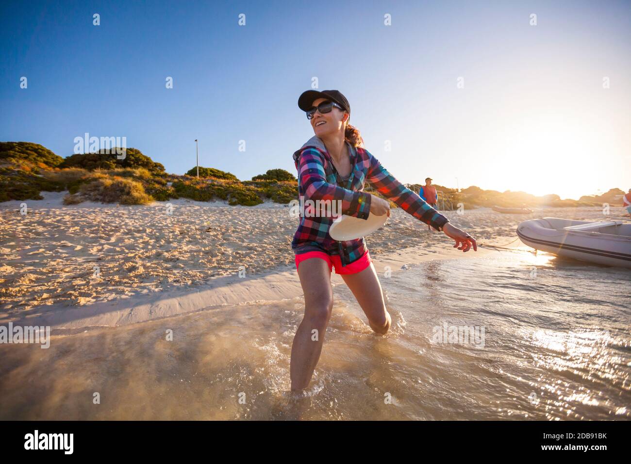 Throwing a frisbee on the beach, Rottnest Island, Australia Stock Photo ...
