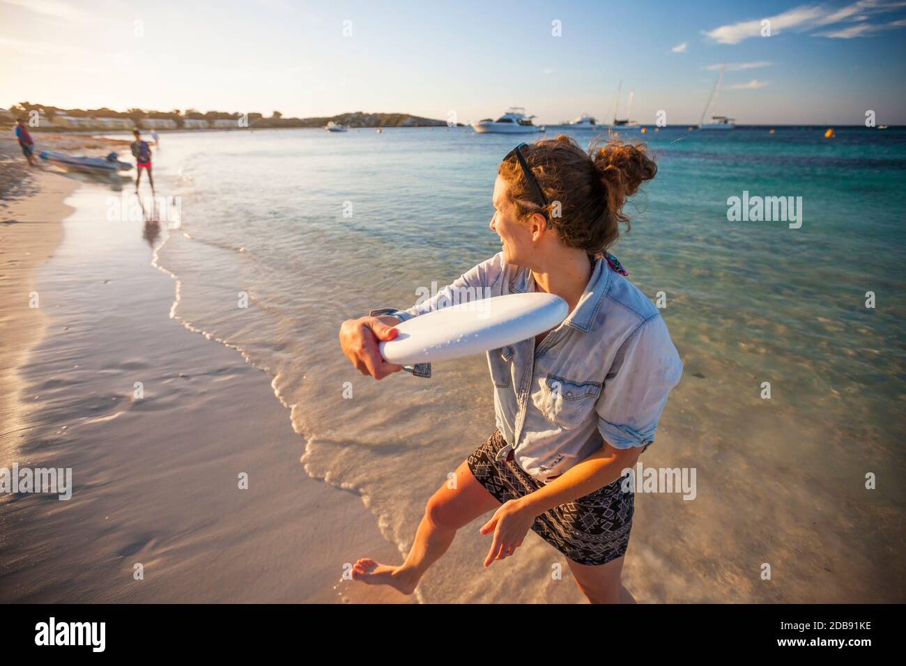Throwing a frisbee on the beach, Rottnest Island, Australia Stock Photo ...