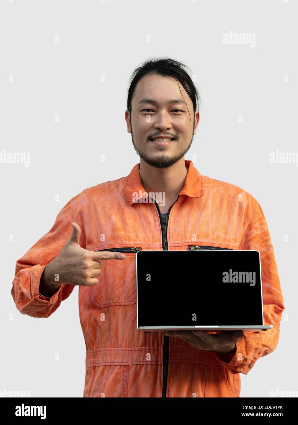 The chief mechanic in an orange uniform holding blank screen laptop ...