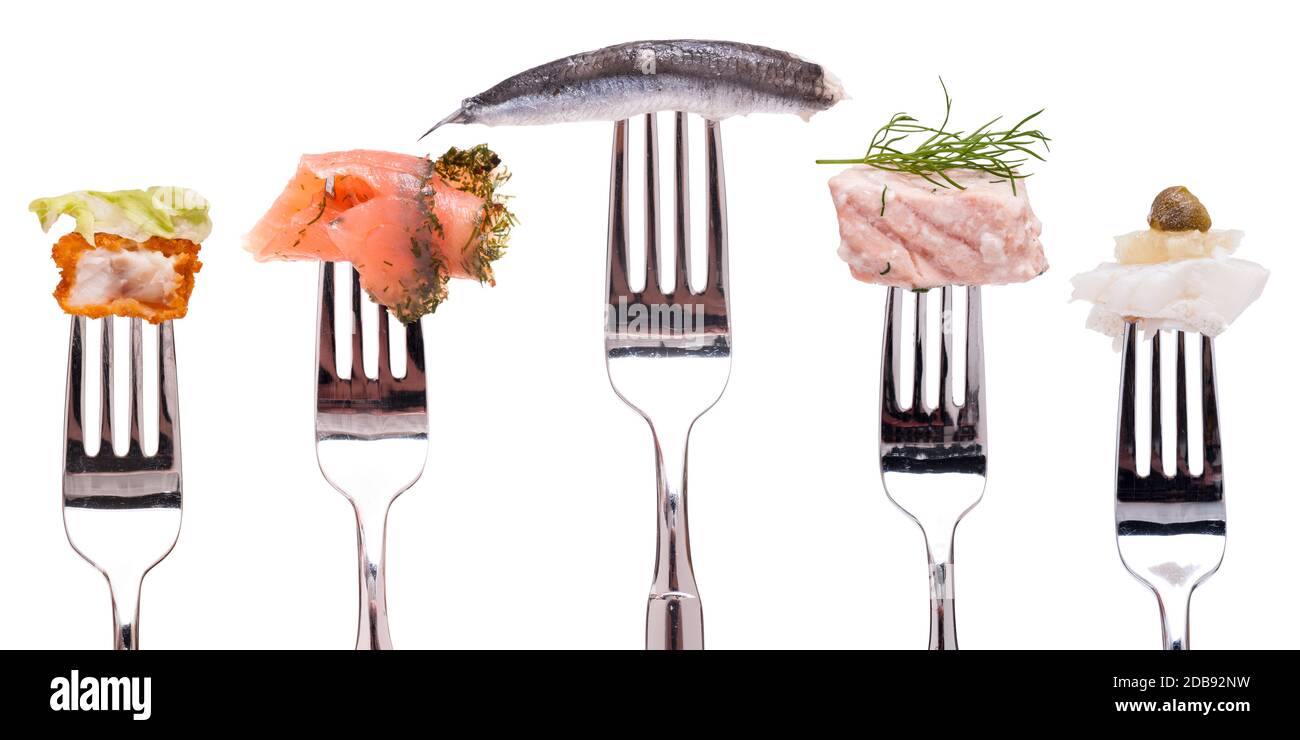 Different kind of fish on a fork white isolated Stock Photo - Alamy
