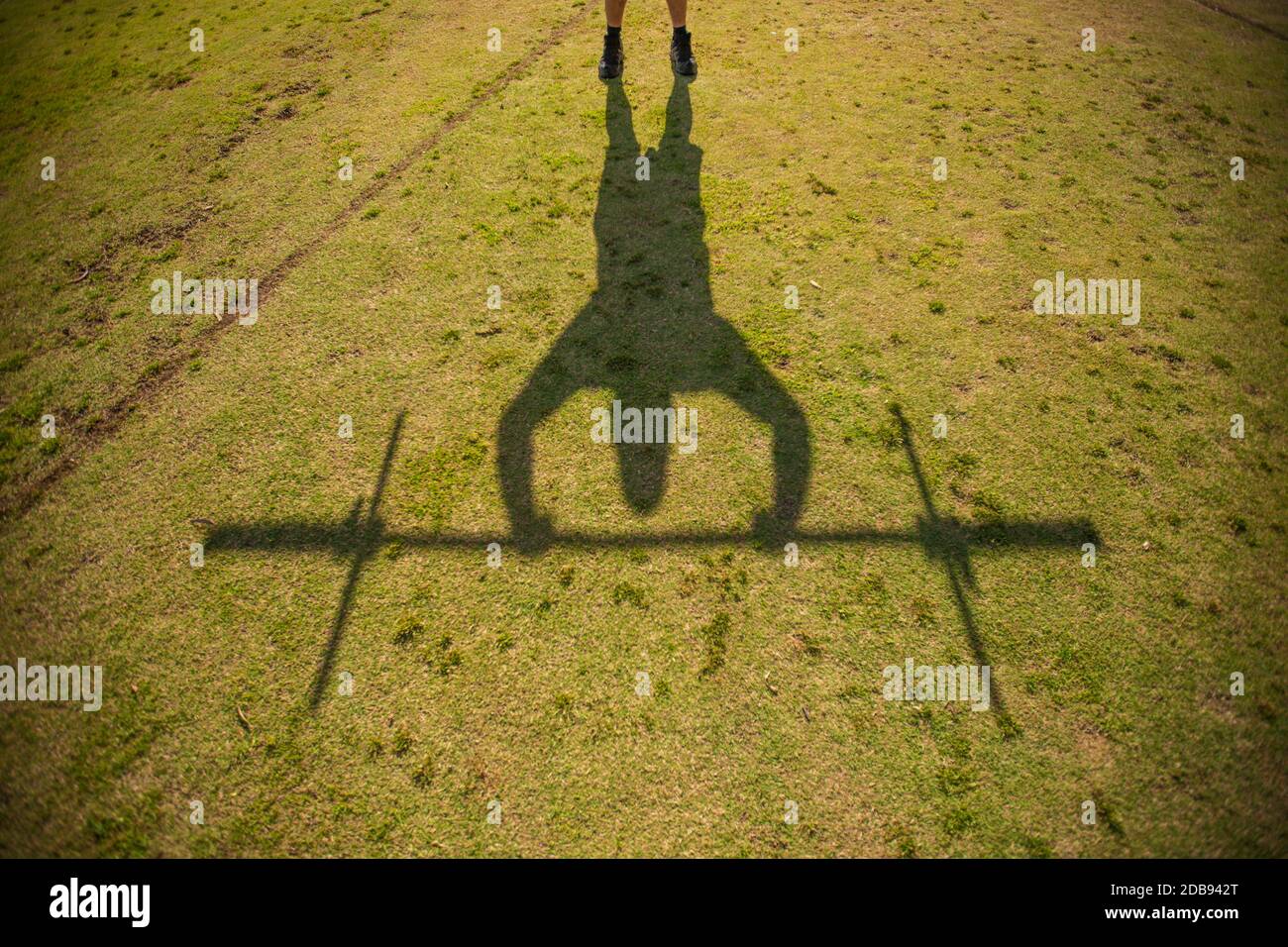 Shadow of man weightlifting Stock Photo - Alamy