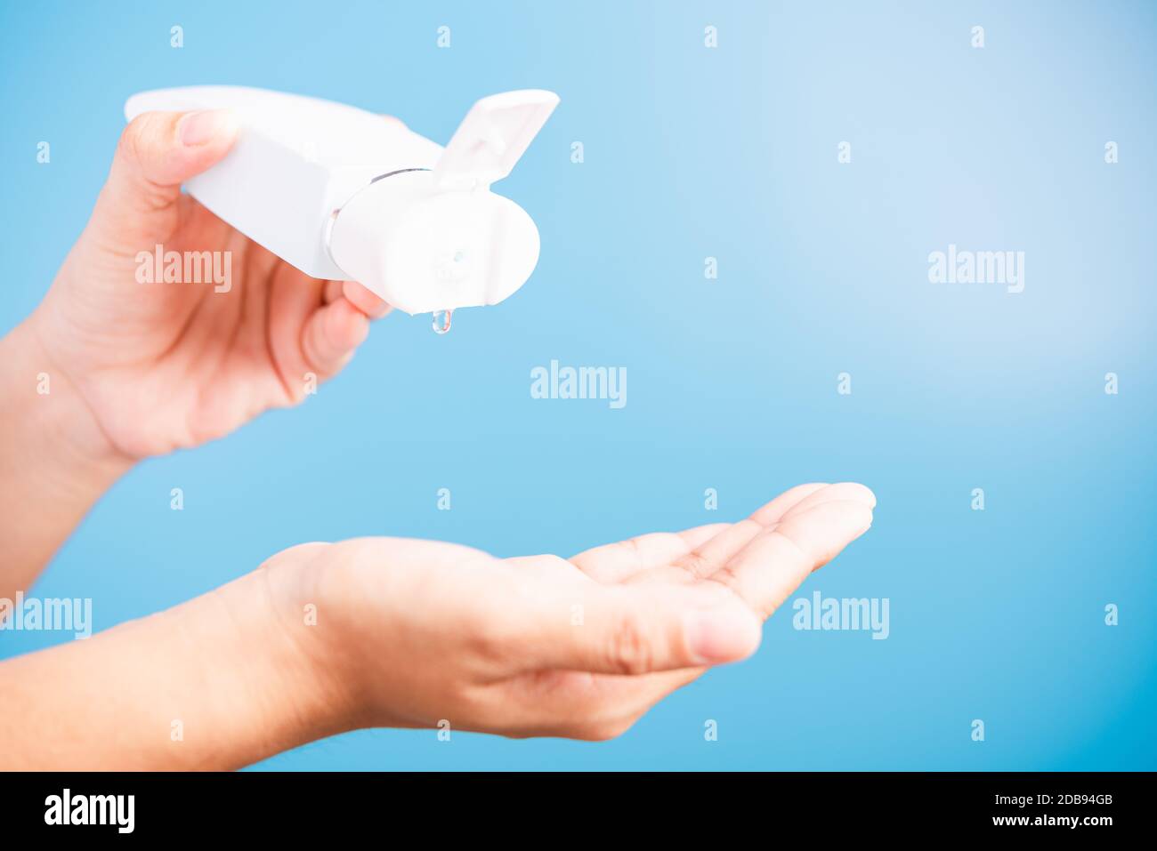 Closeup Hand Asian young woman applying drop dispenser sanitizer ...
