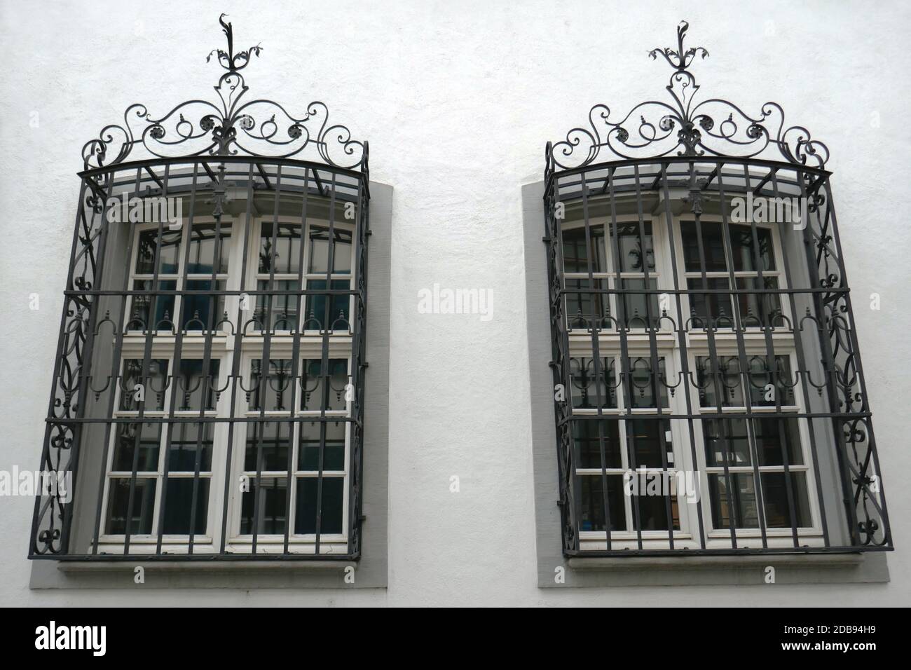 Two barred windows Stock Photo - Alamy
