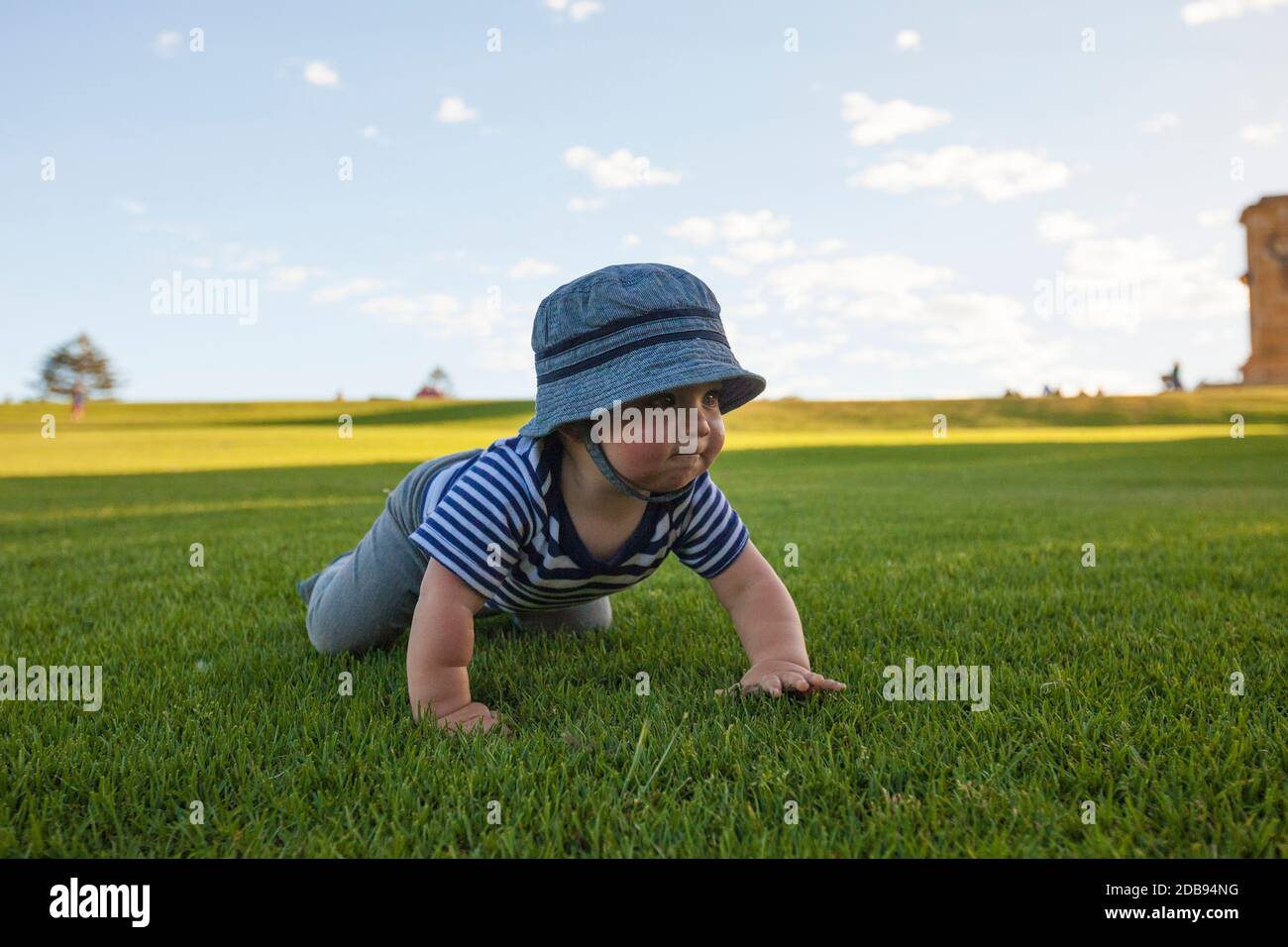 Baby crawling in park hi-res stock photography and images - Alamy