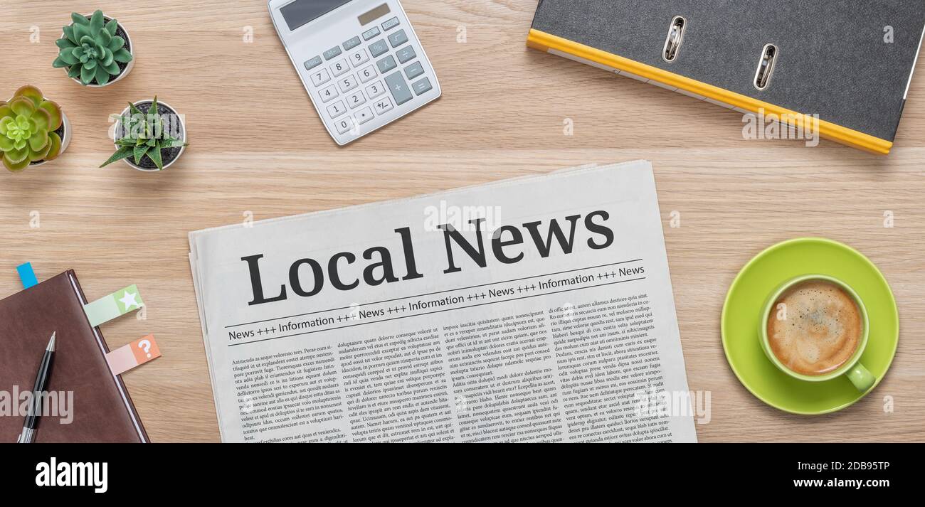 A newspaper on a desk with the headline Local News Stock Photo - Alamy