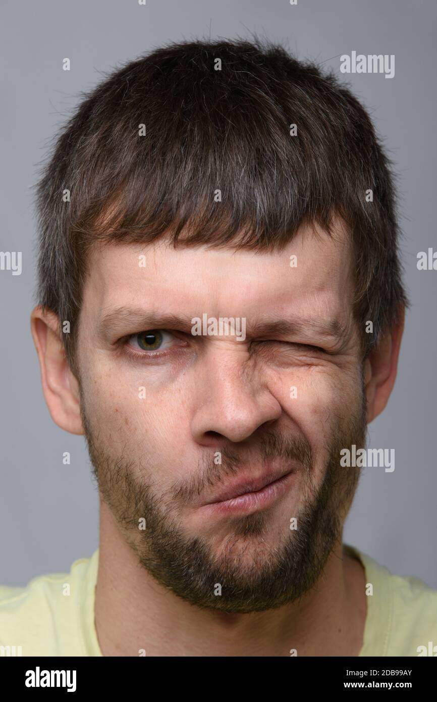 Squinting one eye hi-res stock photography and images - Alamy