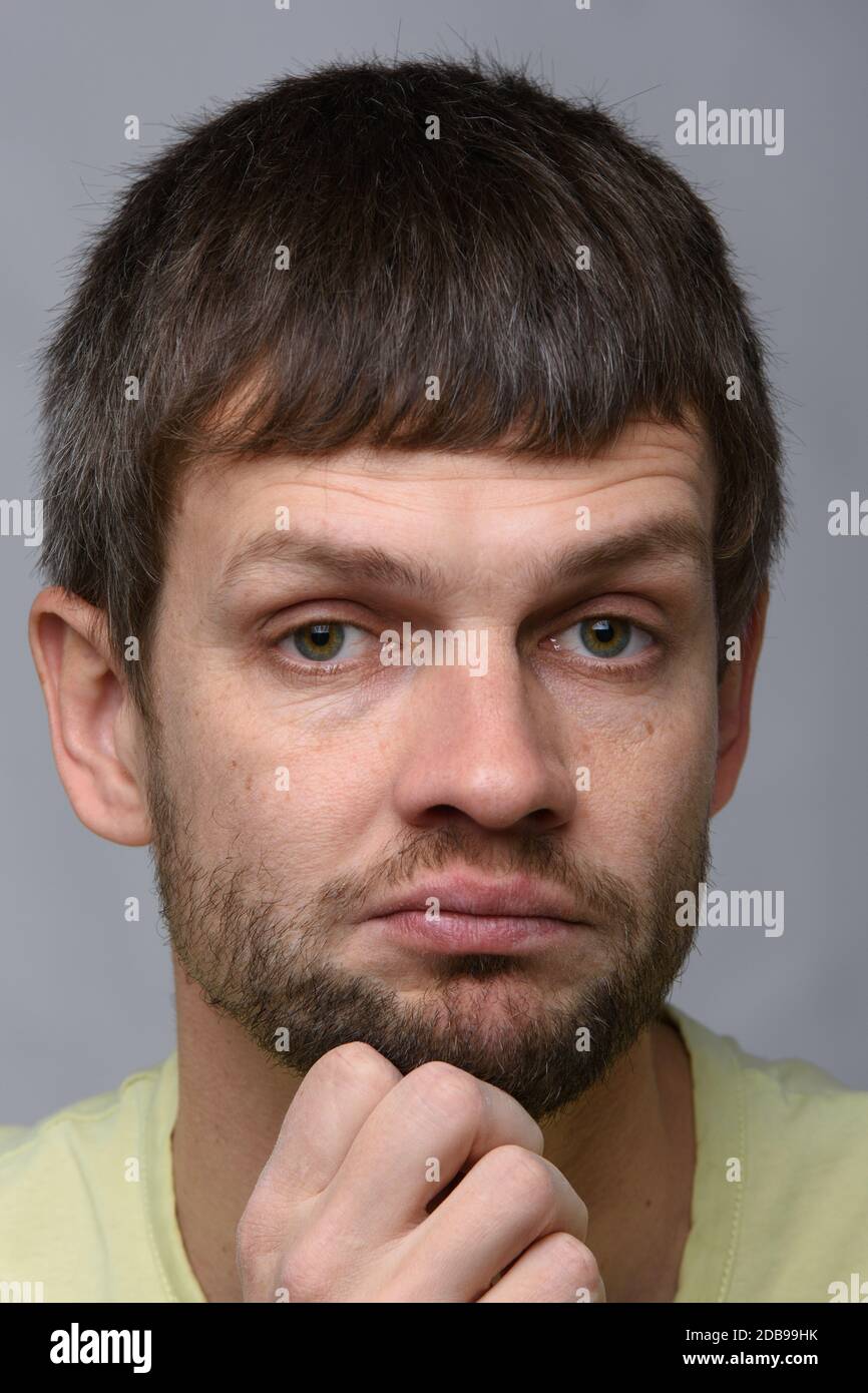 Closeup portrait of a skeptical man of European appearance Stock Photo ...
