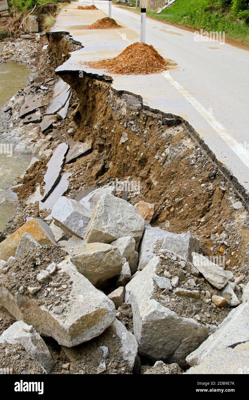 Destroyed road landslide damaged in powerful flood Stock Photo - Alamy