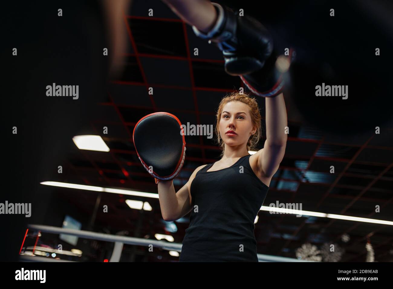 Two women boxing gloves hi-res stock photography and images - Alamy