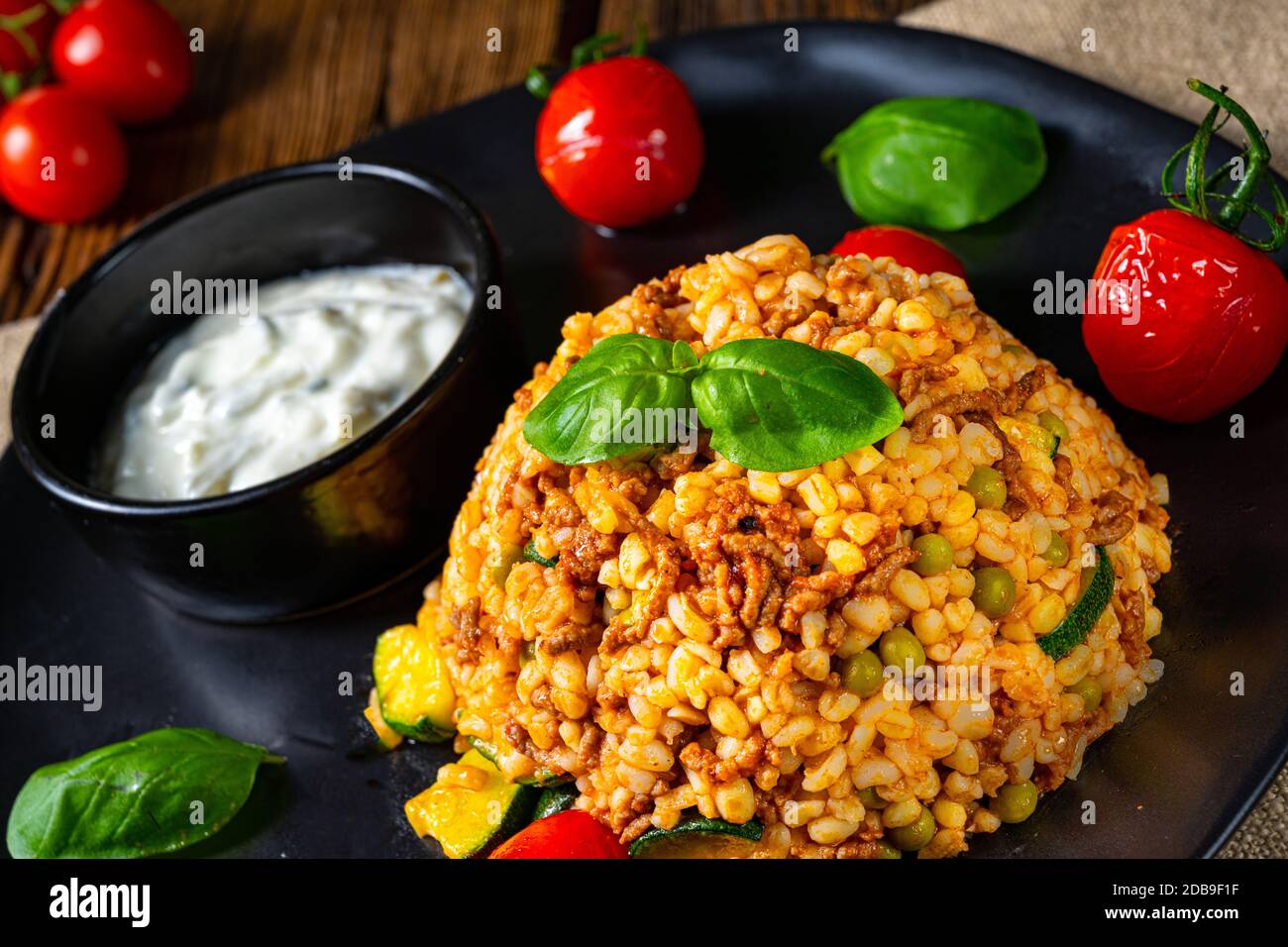 rustic bulgur fried with minced meat and vegetables Stock Photo - Alamy