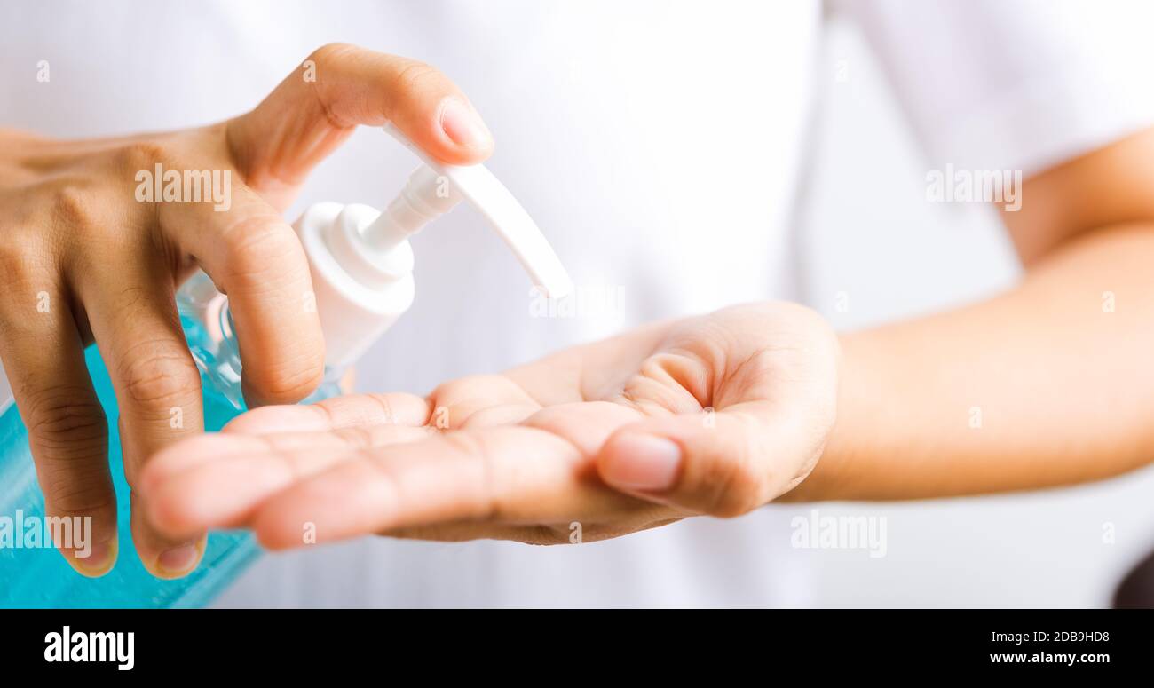 Closeup Hand Asian young woman applying pump dispenser sanitizer ...