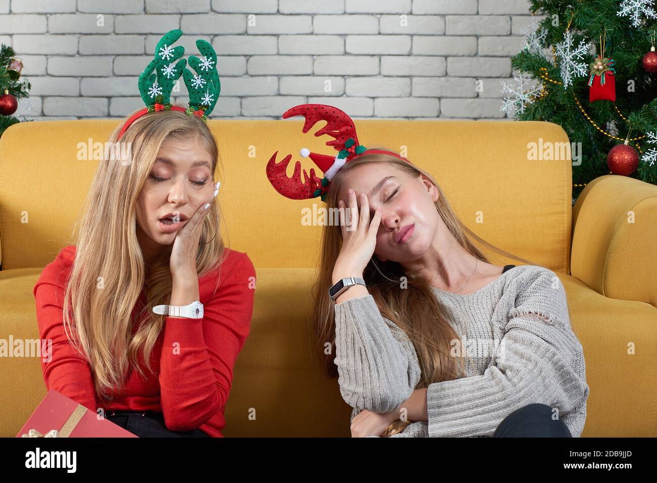 Two white young female are friend depression, tired, drunk and hangover ...