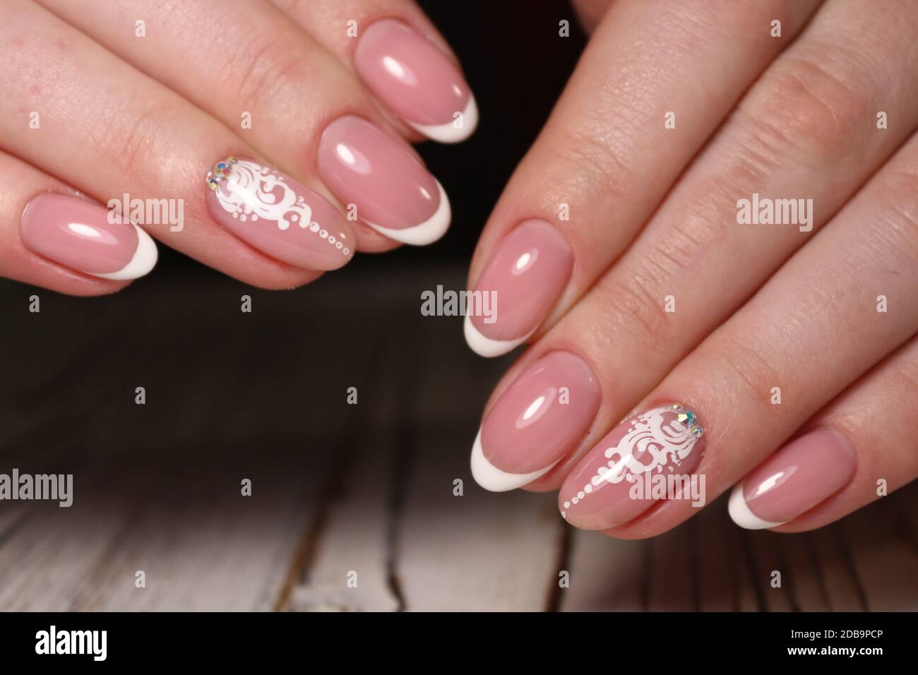 beautiful French manicure on a trendy texture background Stock Photo ...