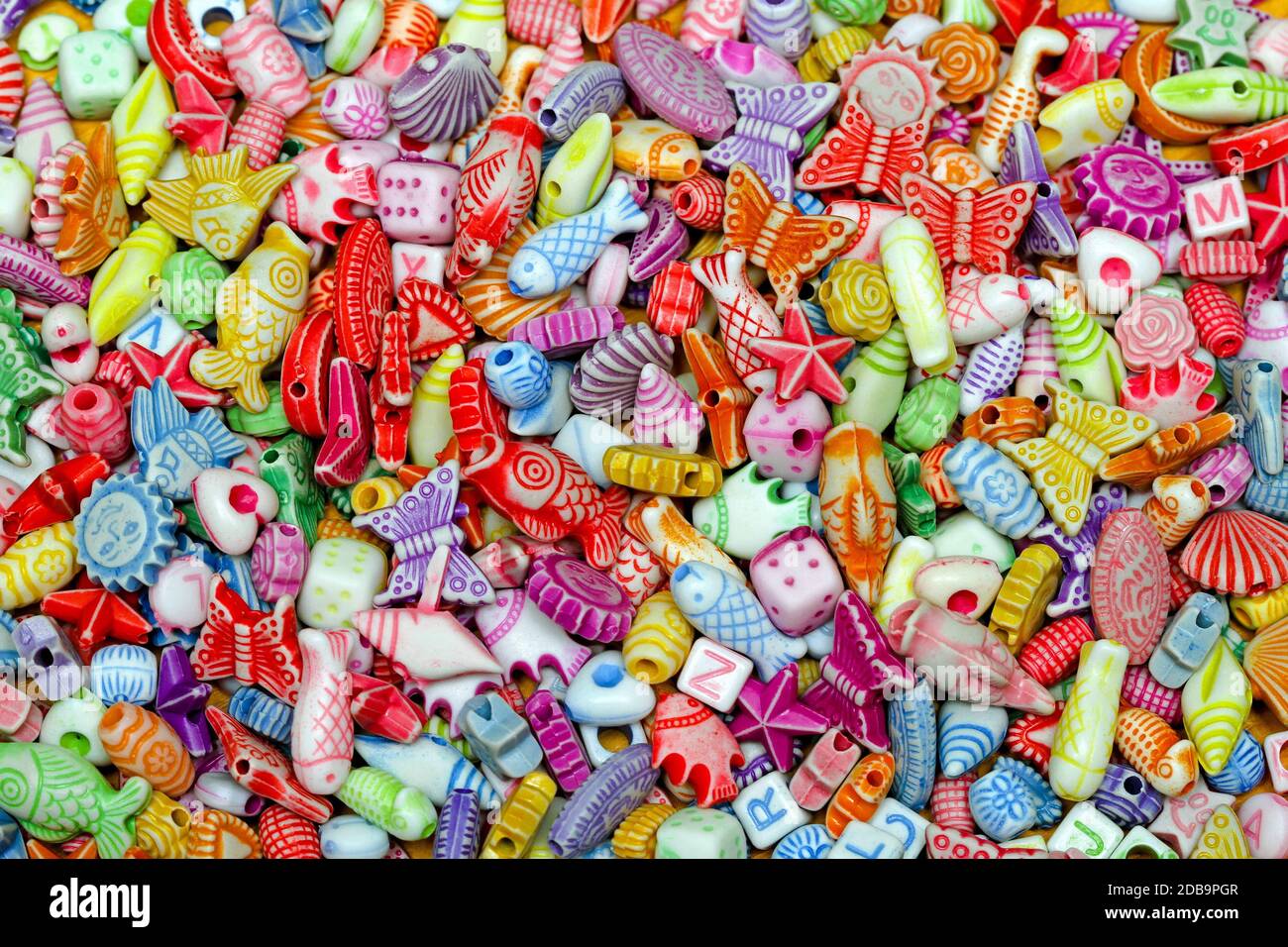 Multi color plastic beads variety assortment background Stock Photo - Alamy