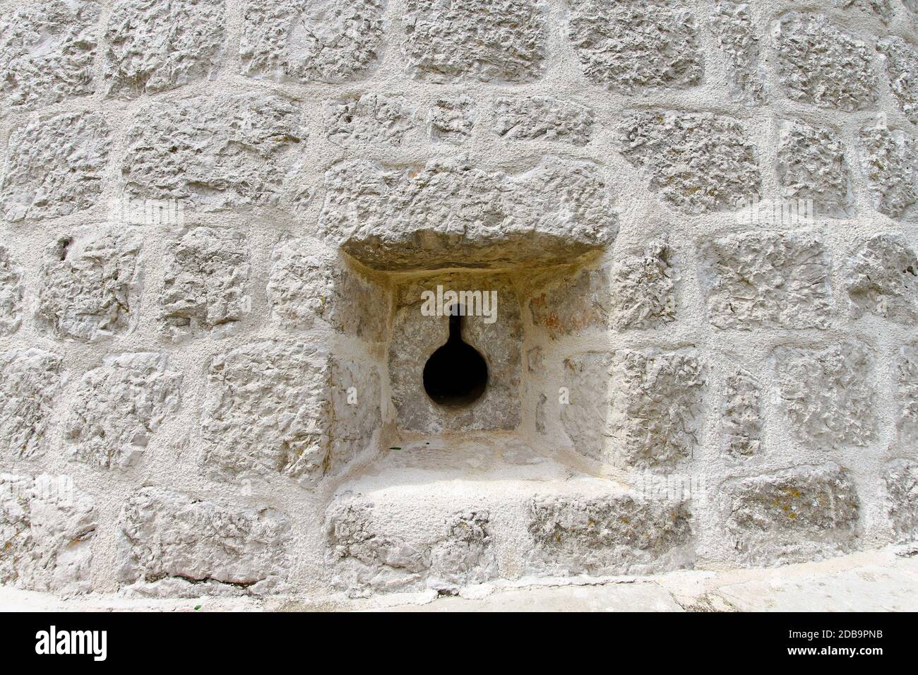 Loophole in wall at medieval castle fortification Stock Photo - Alamy
