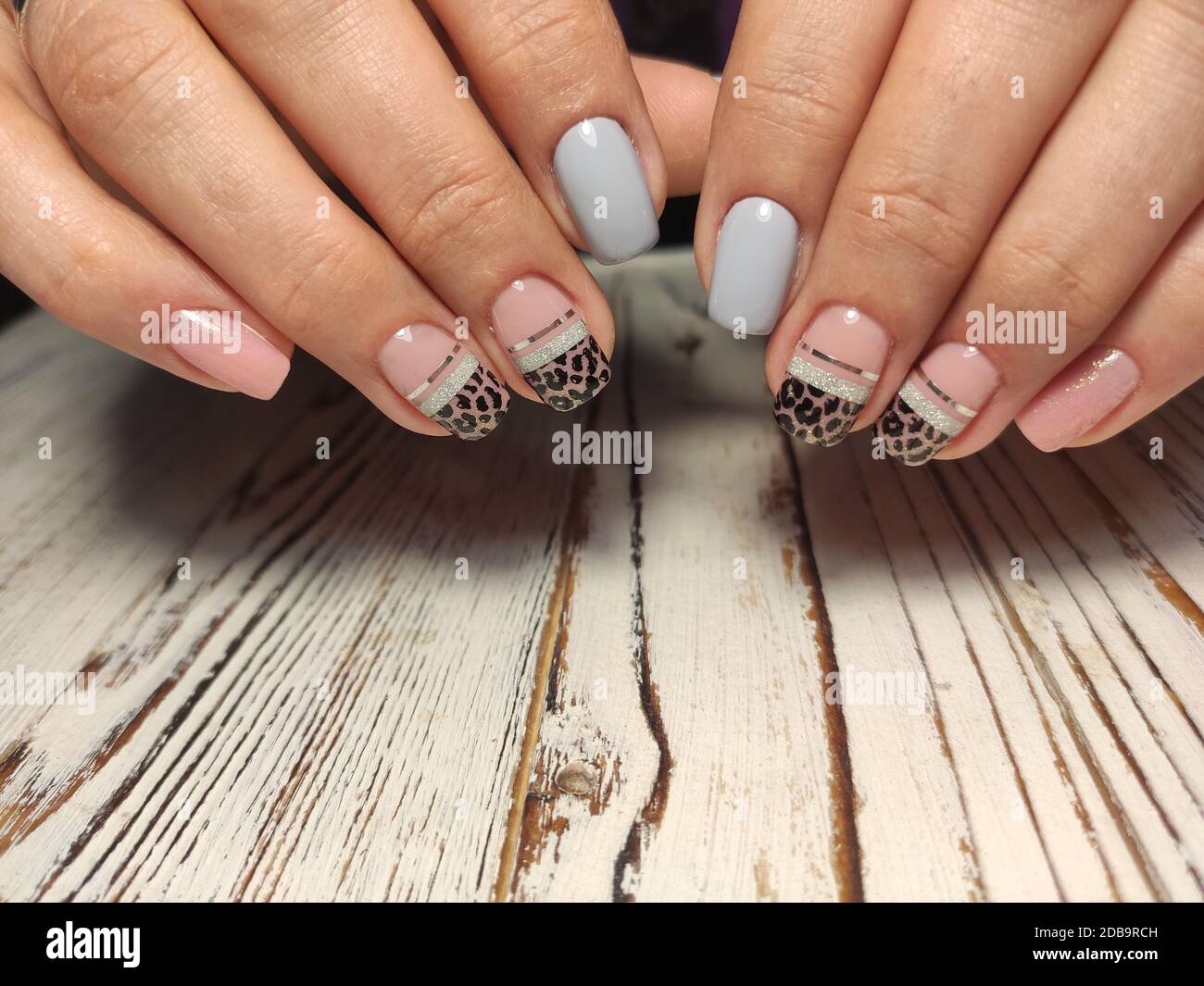 beautiful manicure of nails on the background of a fashionable texture ...