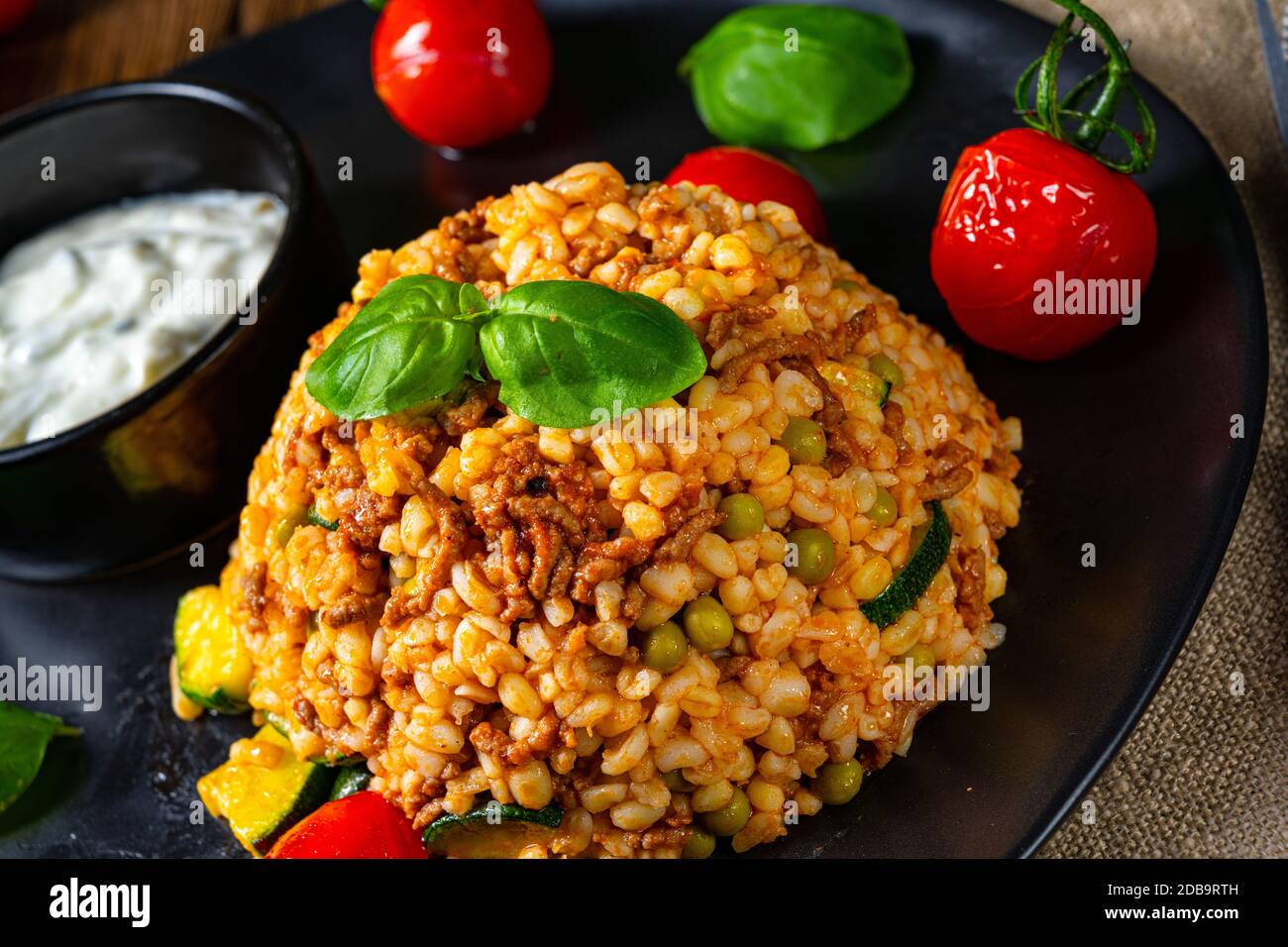 rustic bulgur fried with minced meat and vegetables Stock Photo - Alamy
