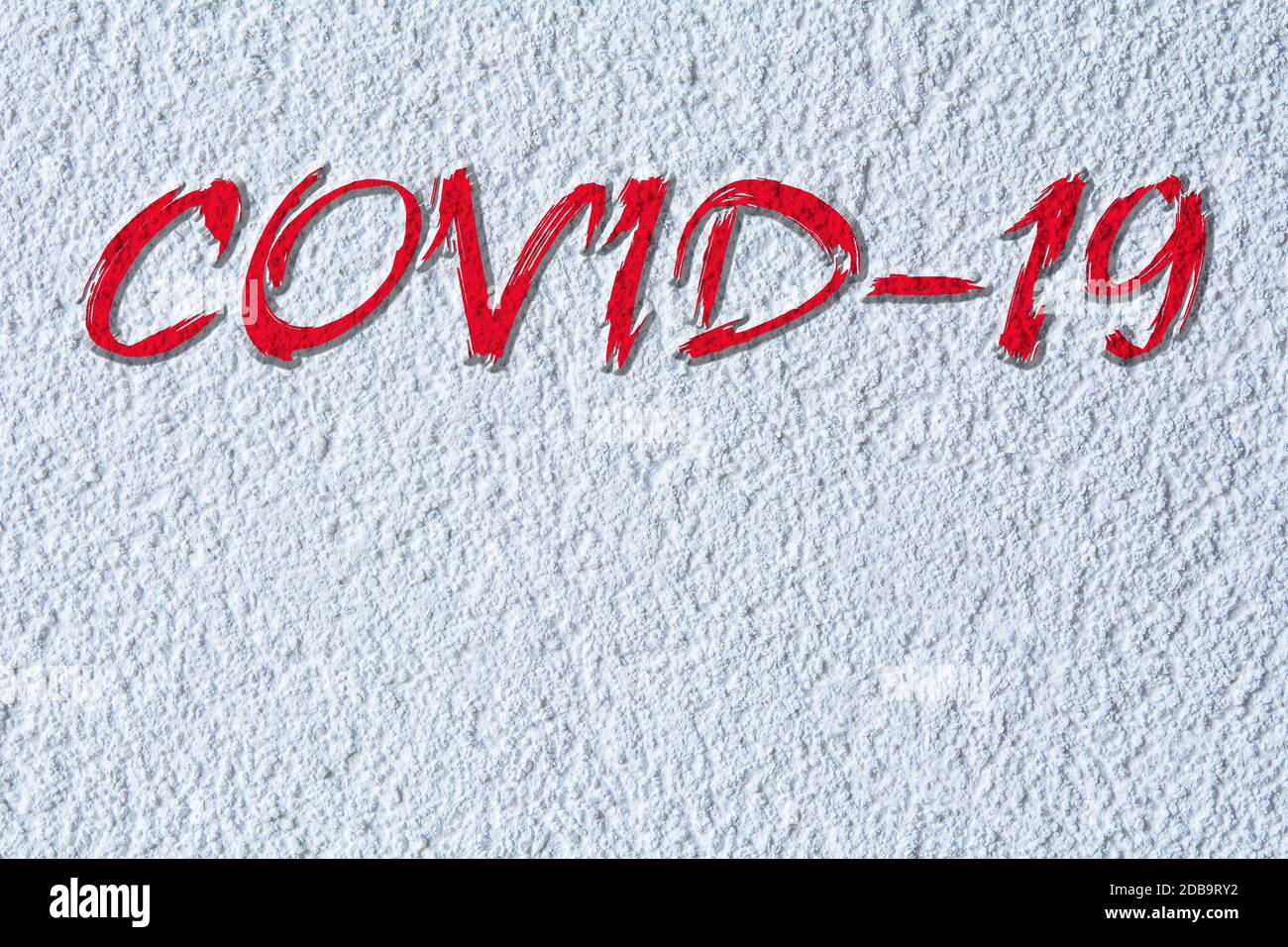 COVID ‑ 19 lettering on a plastered white wall Stock Photo - Alamy