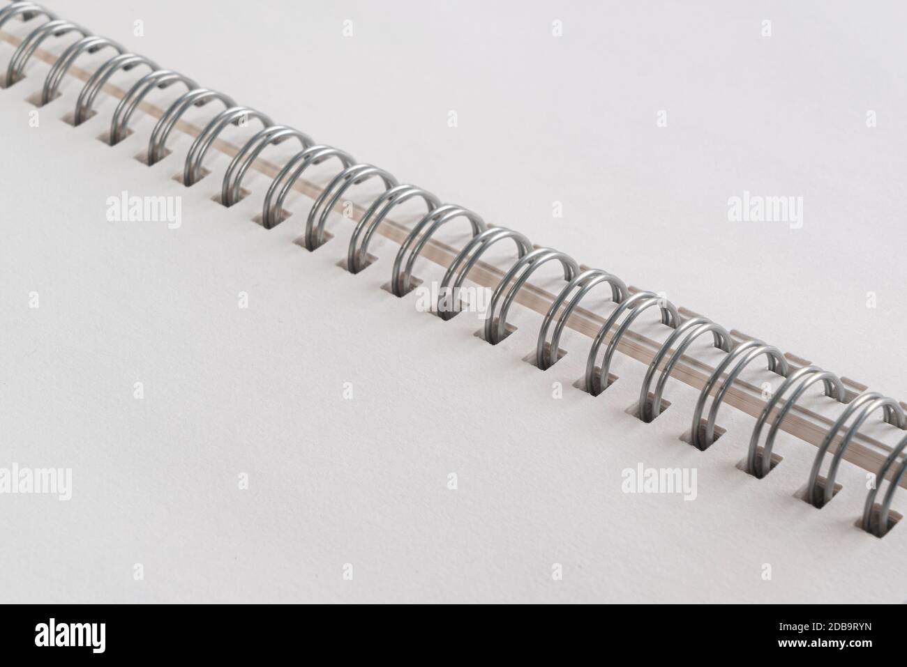 the metallic spiral of a notebook Stock Photo - Alamy