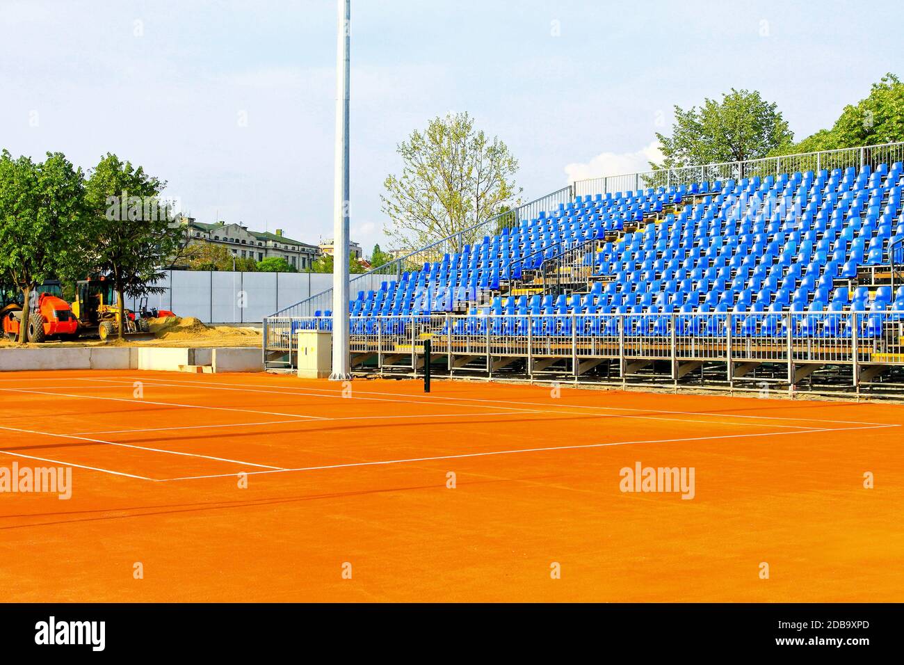 New tennis court with blue stands construction Stock Photo - Alamy