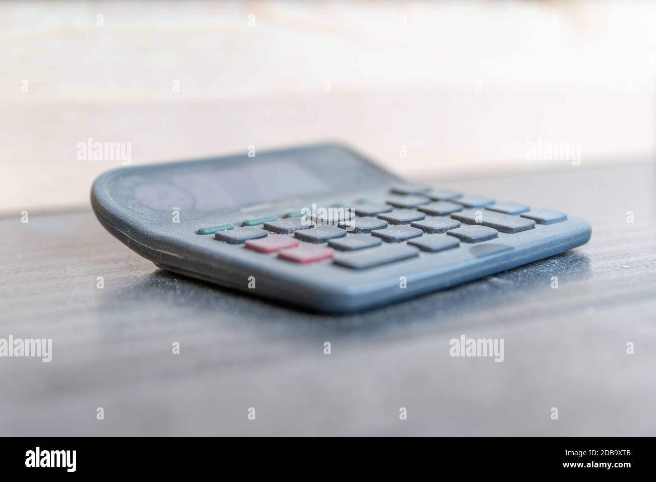 Old dust covered digital calculator Stock Photo - Alamy