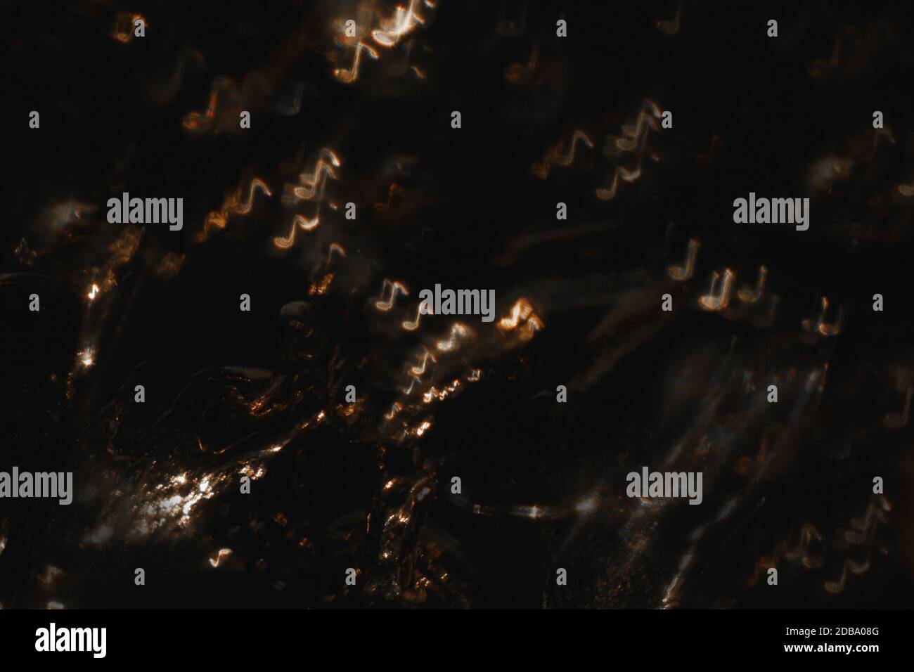 Gold notes on black background Stock Photo - Alamy