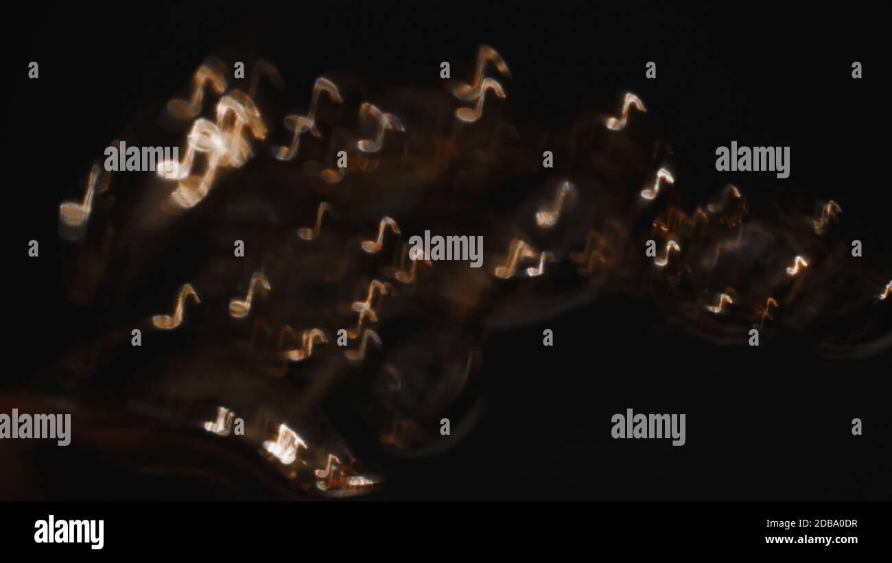 Gold notes on black background Stock Photo - Alamy