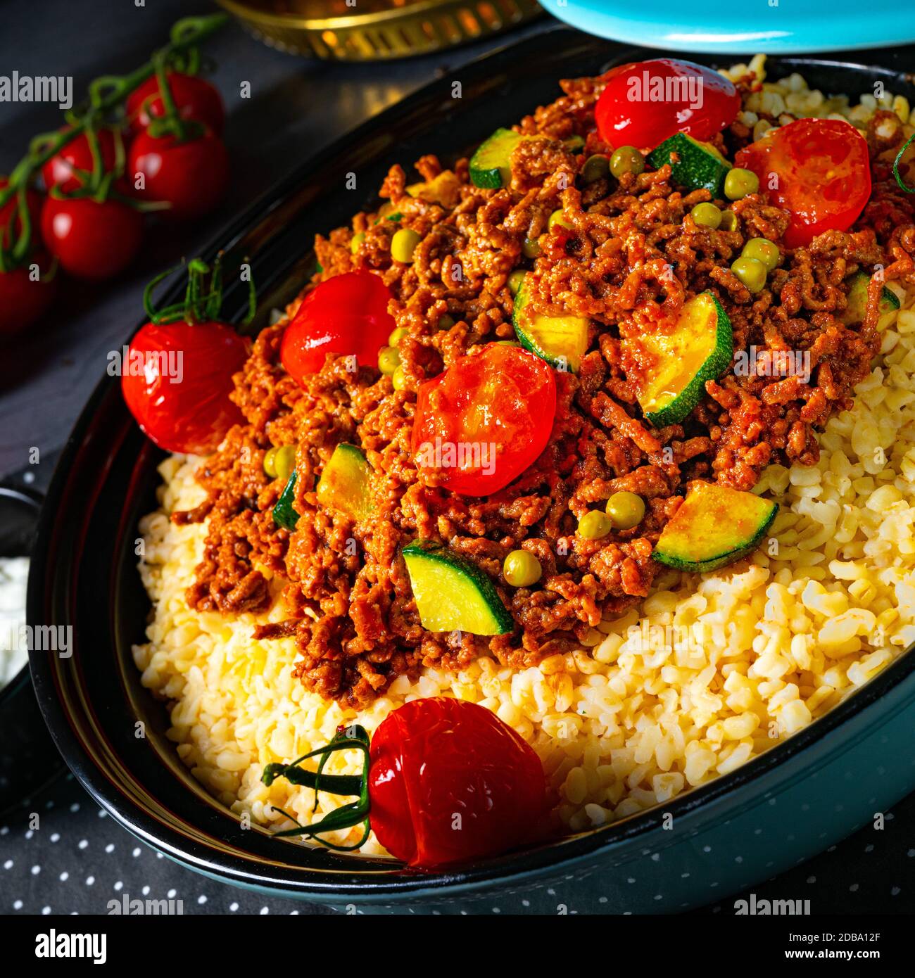 Tomato bulgur with vegetables and minced meat Stock Photo - Alamy