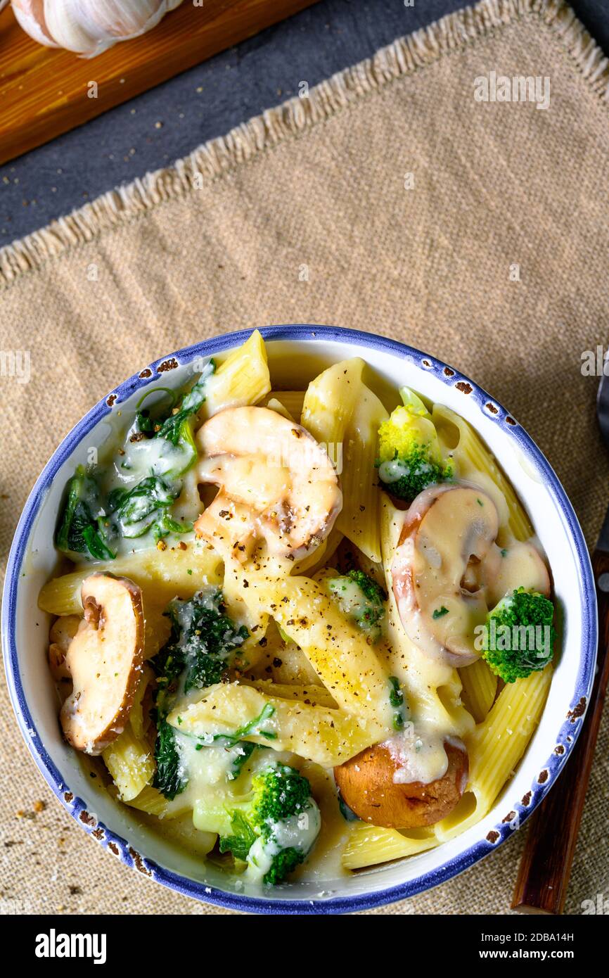 Real pasta with mushrooms, spinach and broccoli Stock Photo - Alamy