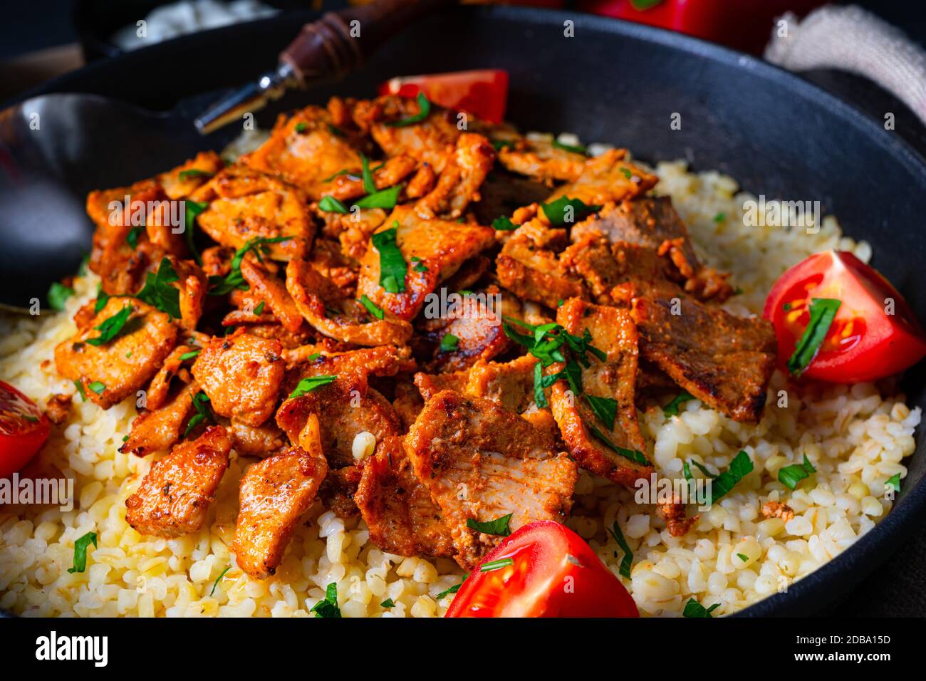rustic bulgur pans with gratinated gyros and yoghurt Stock Photo - Alamy