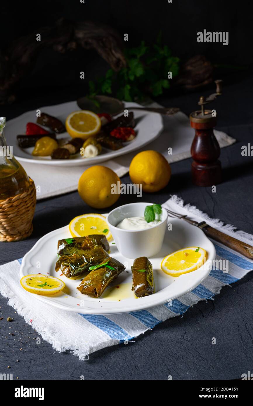 Dolmades - stuffed grape leaves the Greek way Stock Photo - Alamy