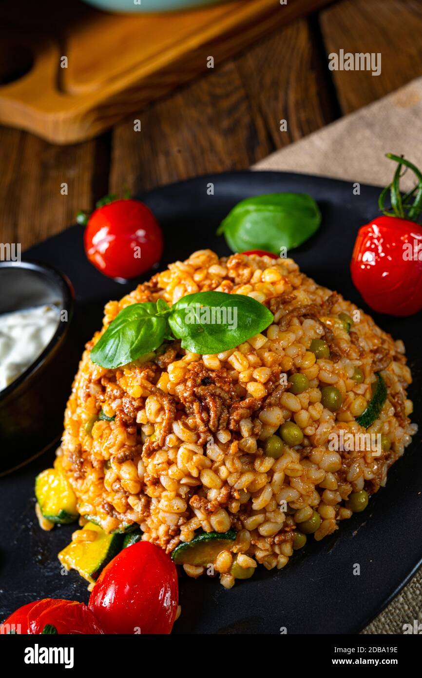 rustic bulgur fried with minced meat and vegetables Stock Photo - Alamy