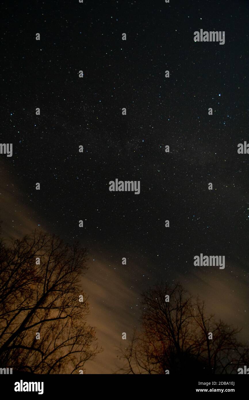 A Dark Night sky Full of Stars and Orange Clouds During Autumn Stock ...