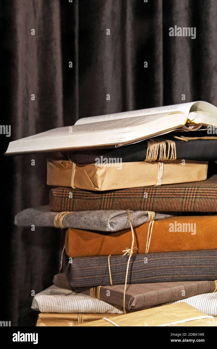 Pile of books packed in recycled wrapping Stock Photo - Alamy