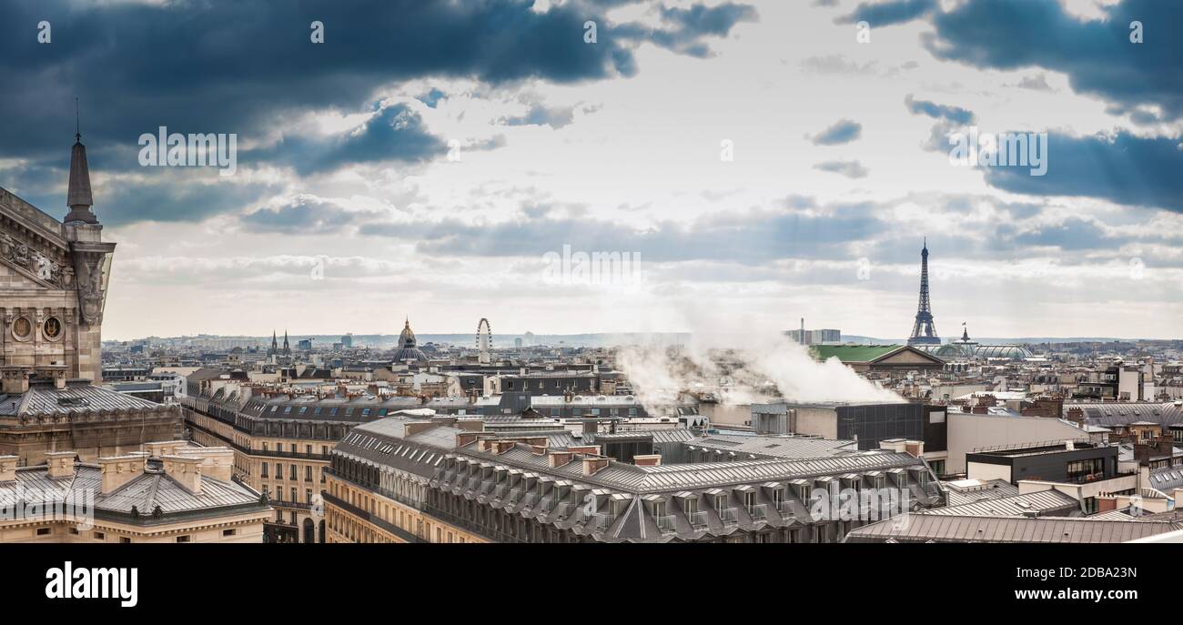 Sun rays over the beautiful Paris City in a cold winter day Stock Photo ...