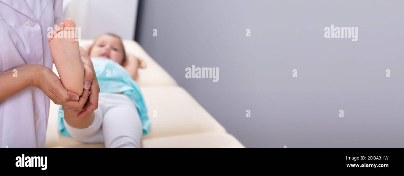 Chiropractor Doing Feet Injury Rehab Massage To Kid Stock Photo - Alamy