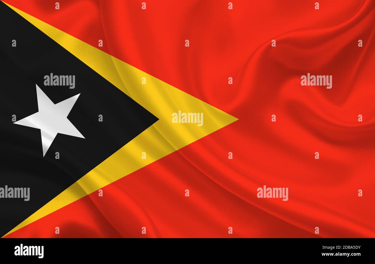 Flag of Timor country on wavy silk fabric background panorama ...