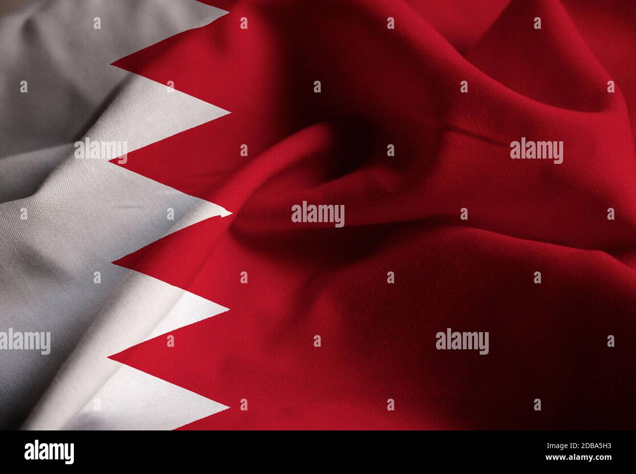 Ruffled Flag of Bahrain Blowing in Wind Stock Photo - Alamy