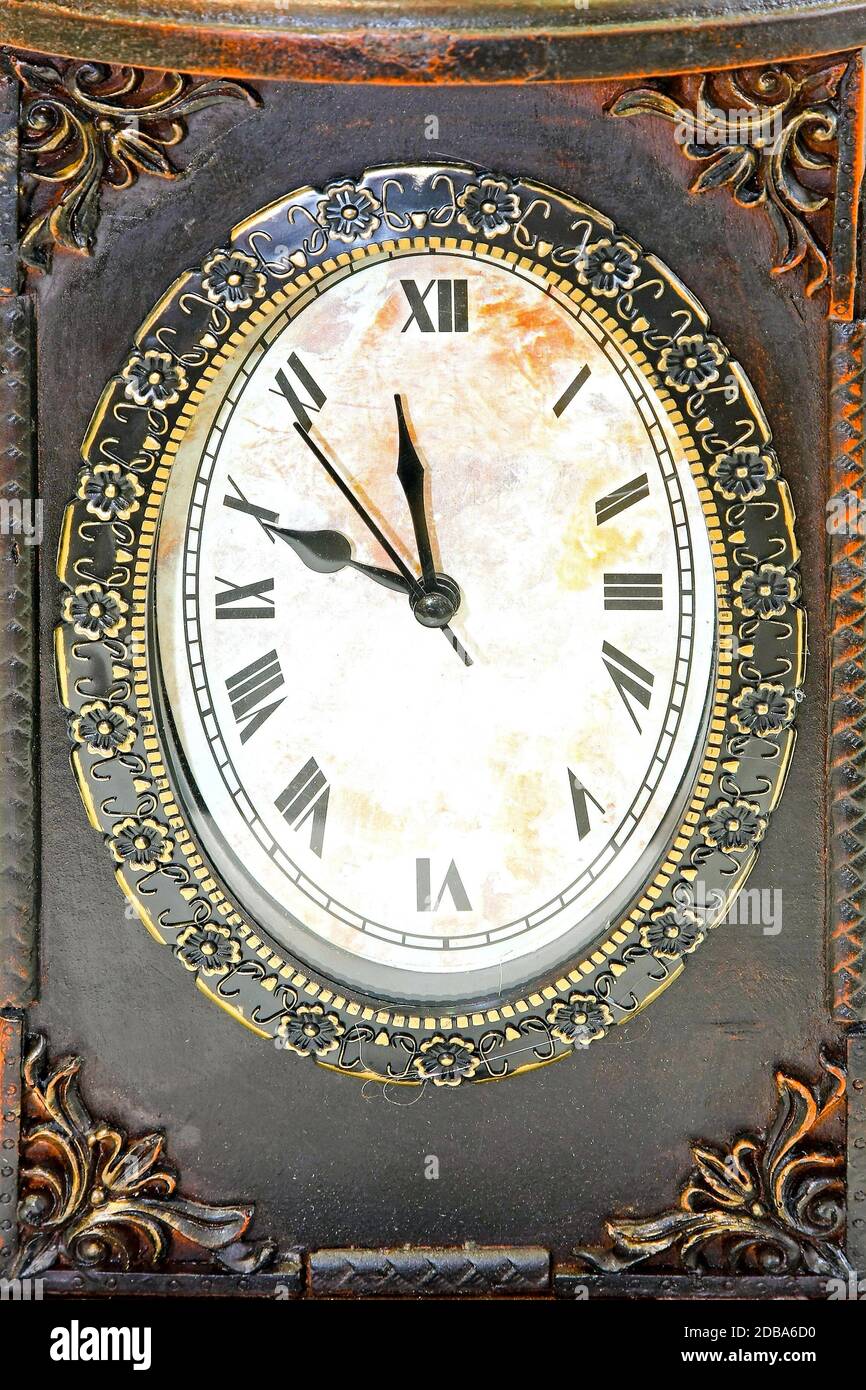 Close up shot of old oval clock Stock Photo - Alamy