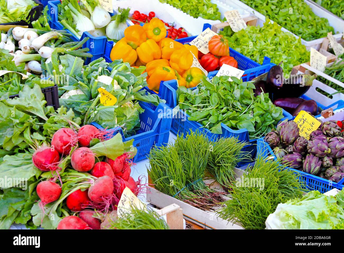 Bunch of organic vegetables sold on market stall Stock Photo - Alamy