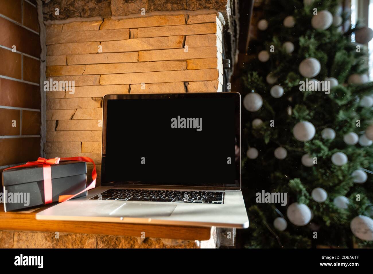 laptop and christmas tree in an old wooden house Stock Photo - Alamy