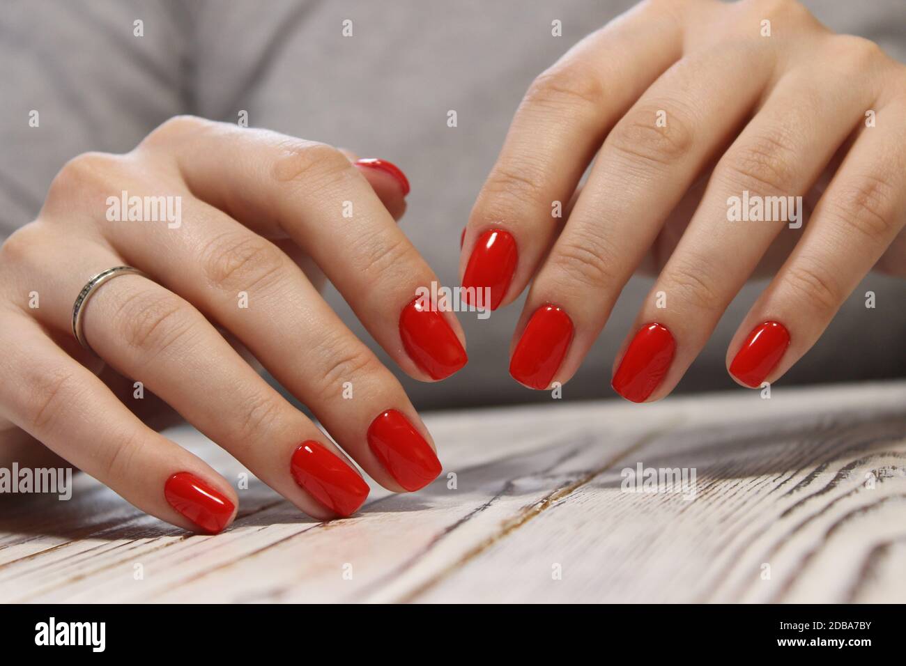fashionable red manicure on long beautiful nails Stock Photo - Alamy