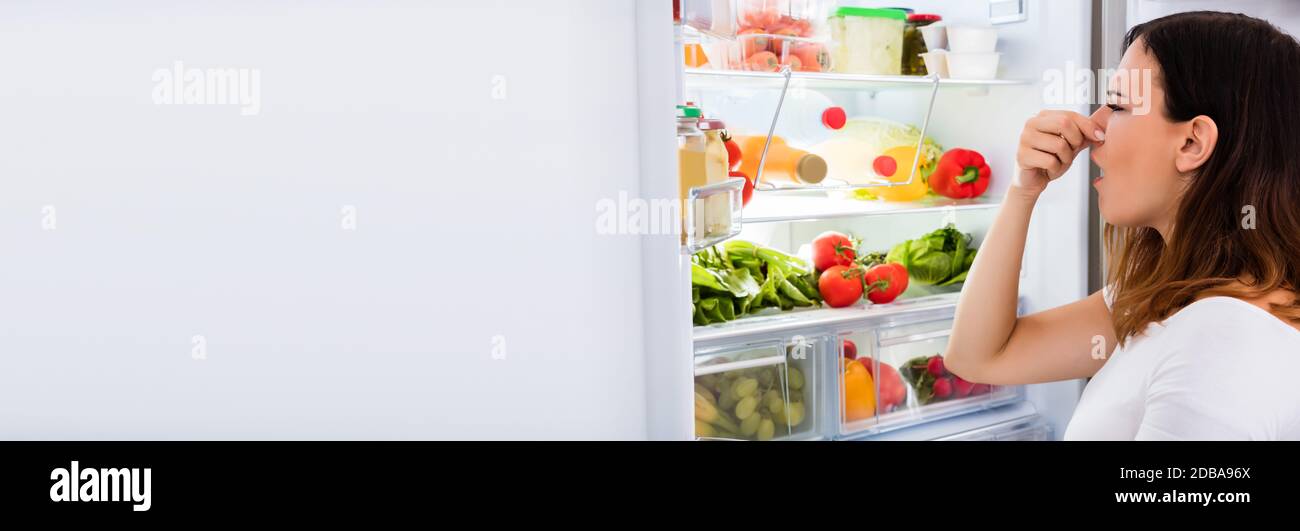 Woman smelling bad food hi-res stock photography and images - Alamy
