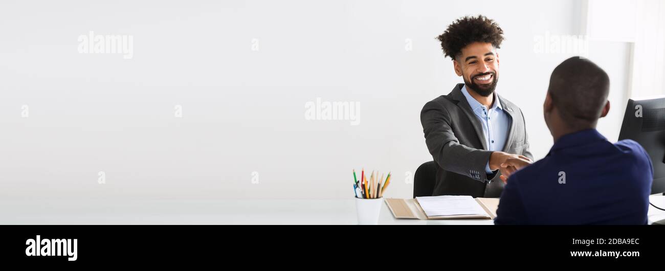 African American Recruiter Shaking Hands At Interview Stock Photo - Alamy