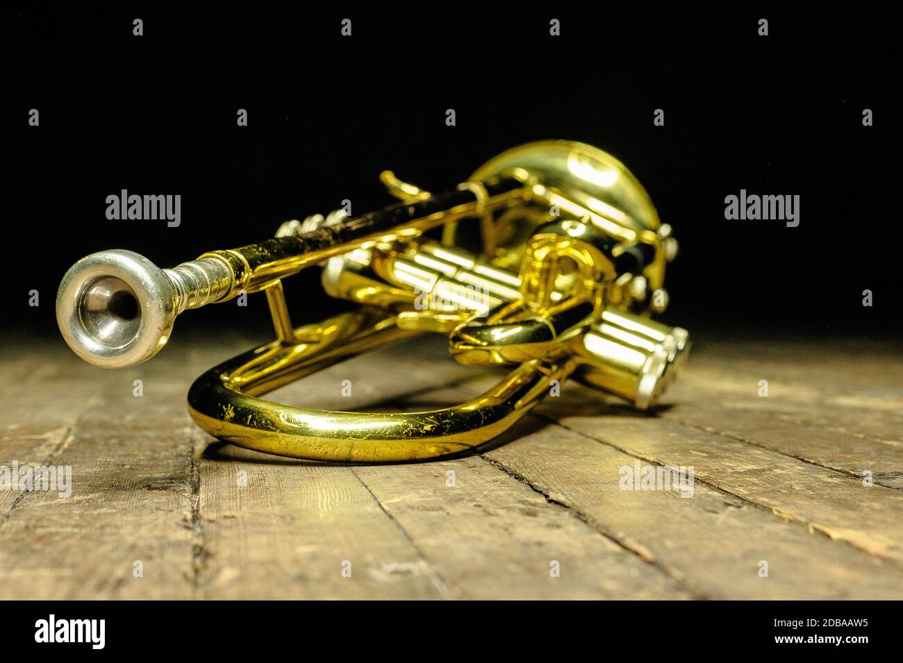 Brass instrument - yellow trumpet on stage with backlight Stock Photo ...