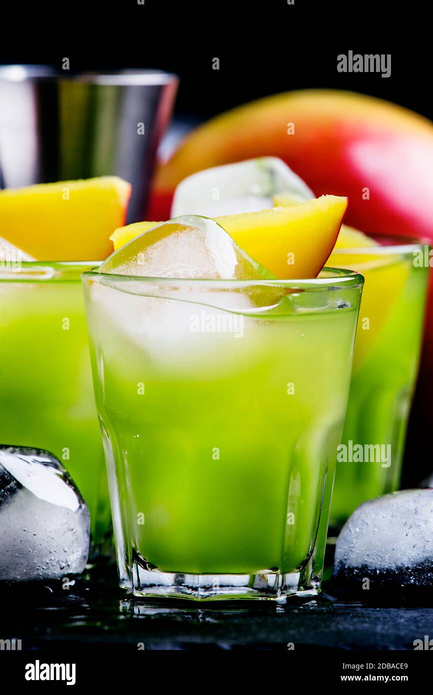 Alcoholic cocktail Aztec, with gold tequila, blue curacao liqueur ...