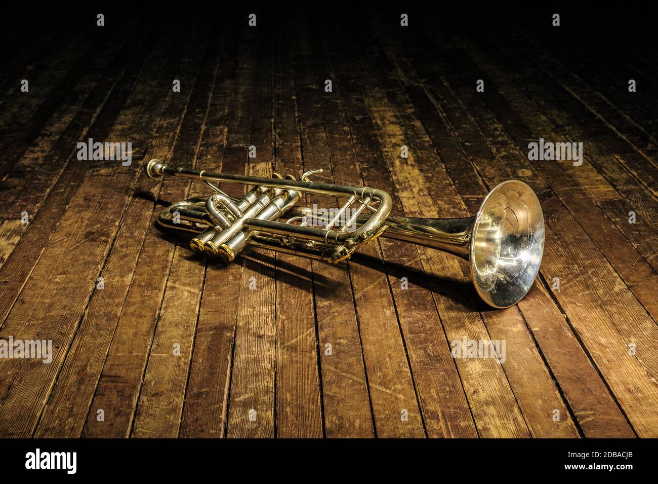white brass trumpet lies on a wooden stage Stock Photo - Alamy